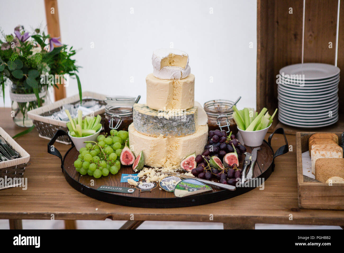 Cheese cake tower made up of various different cheese wheels farmed ...