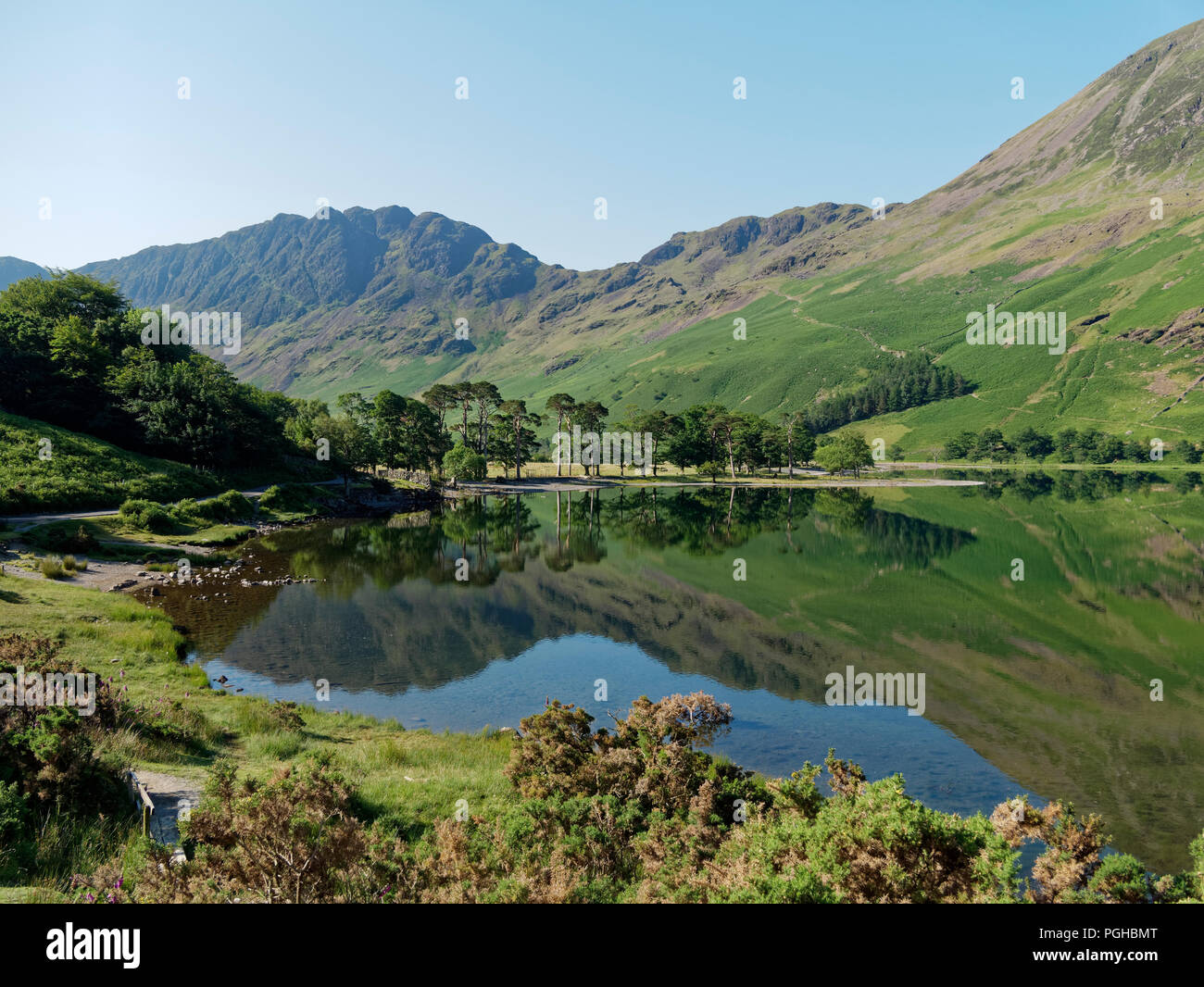 A calm day in the English Lake District shows the famous Buttermere ...