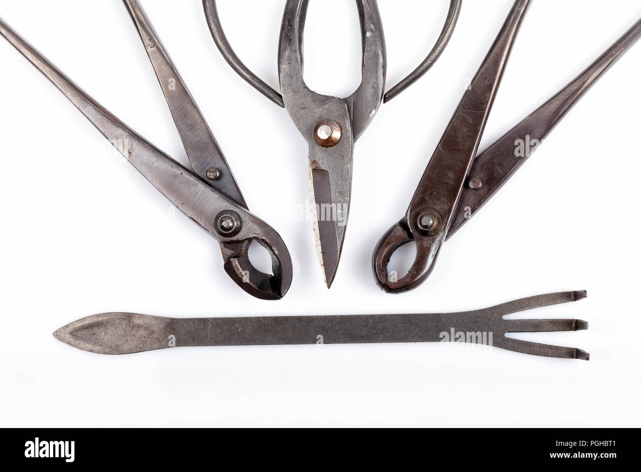 Four indispensable tools to grow bonsai isolated on white. Concave ...