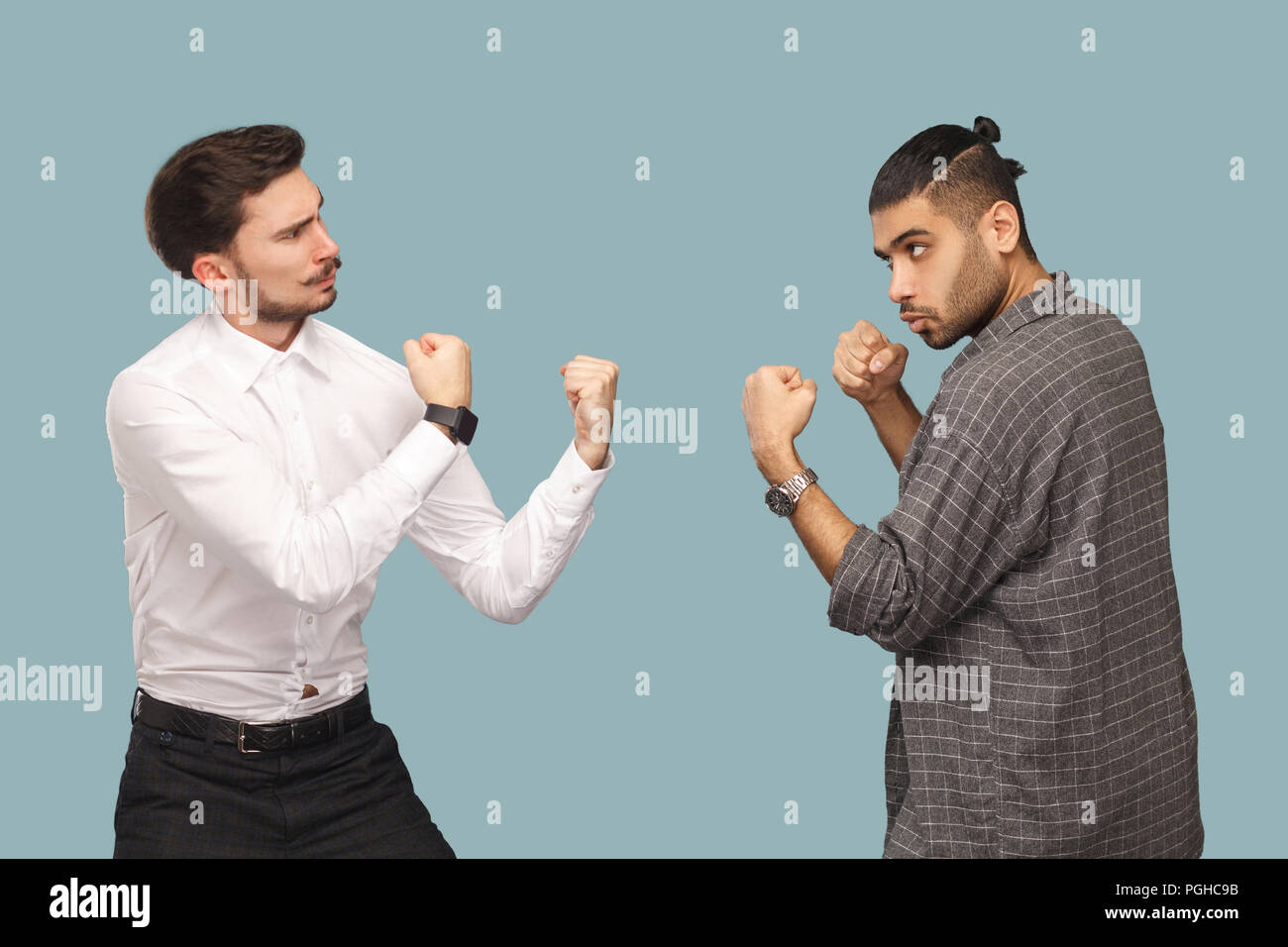 profile side view of two angry boxer businessman, looking to each other ...
