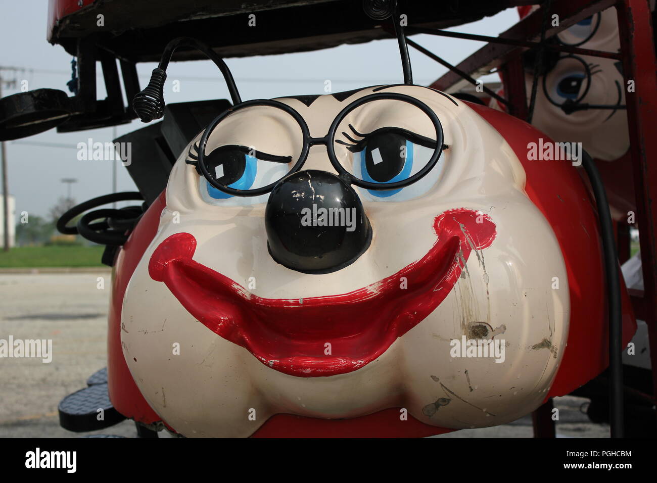 Traveling kiddie lady bug carnival ride under construction in a ...