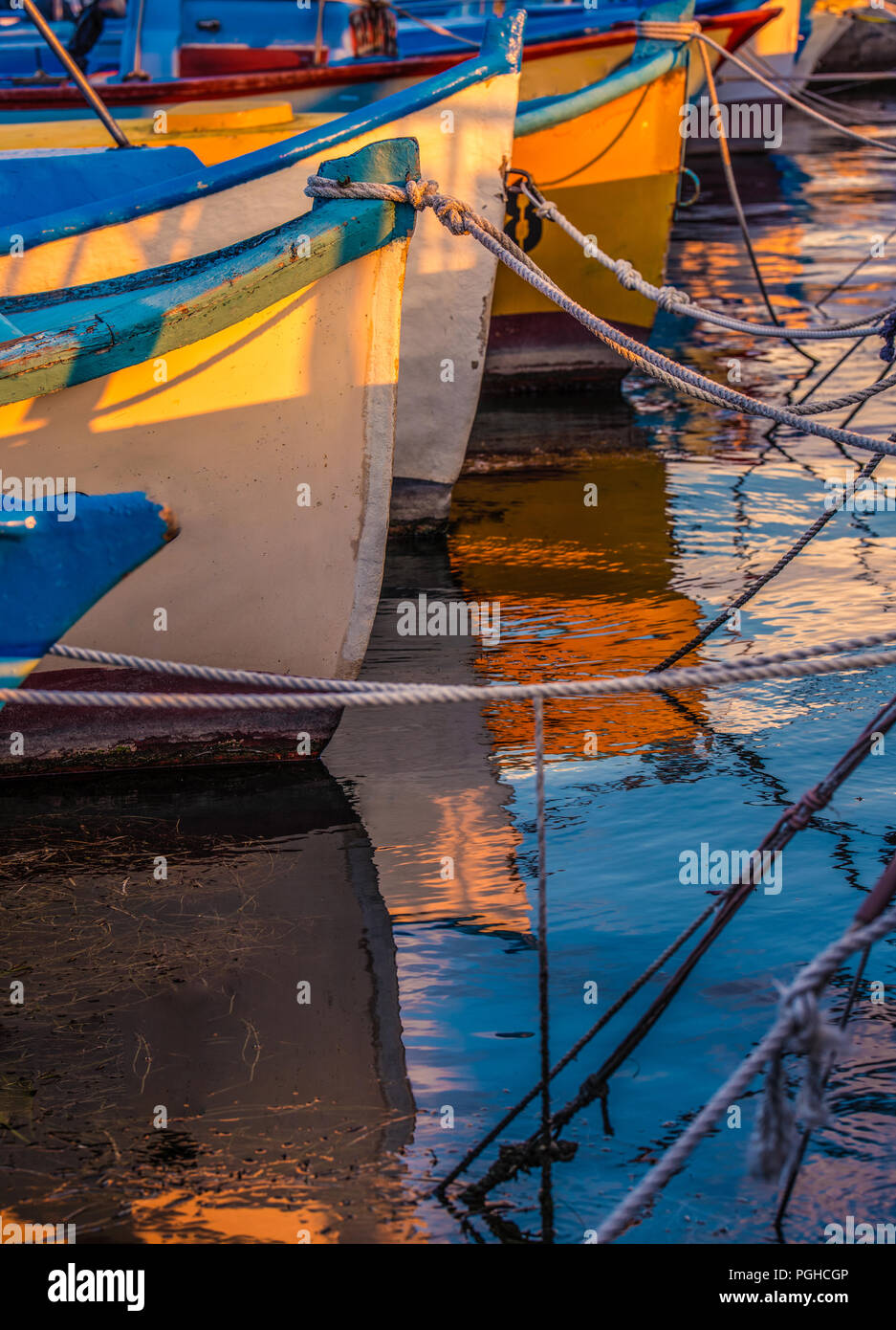 Reflection of boats in the water Stock Photo - Alamy