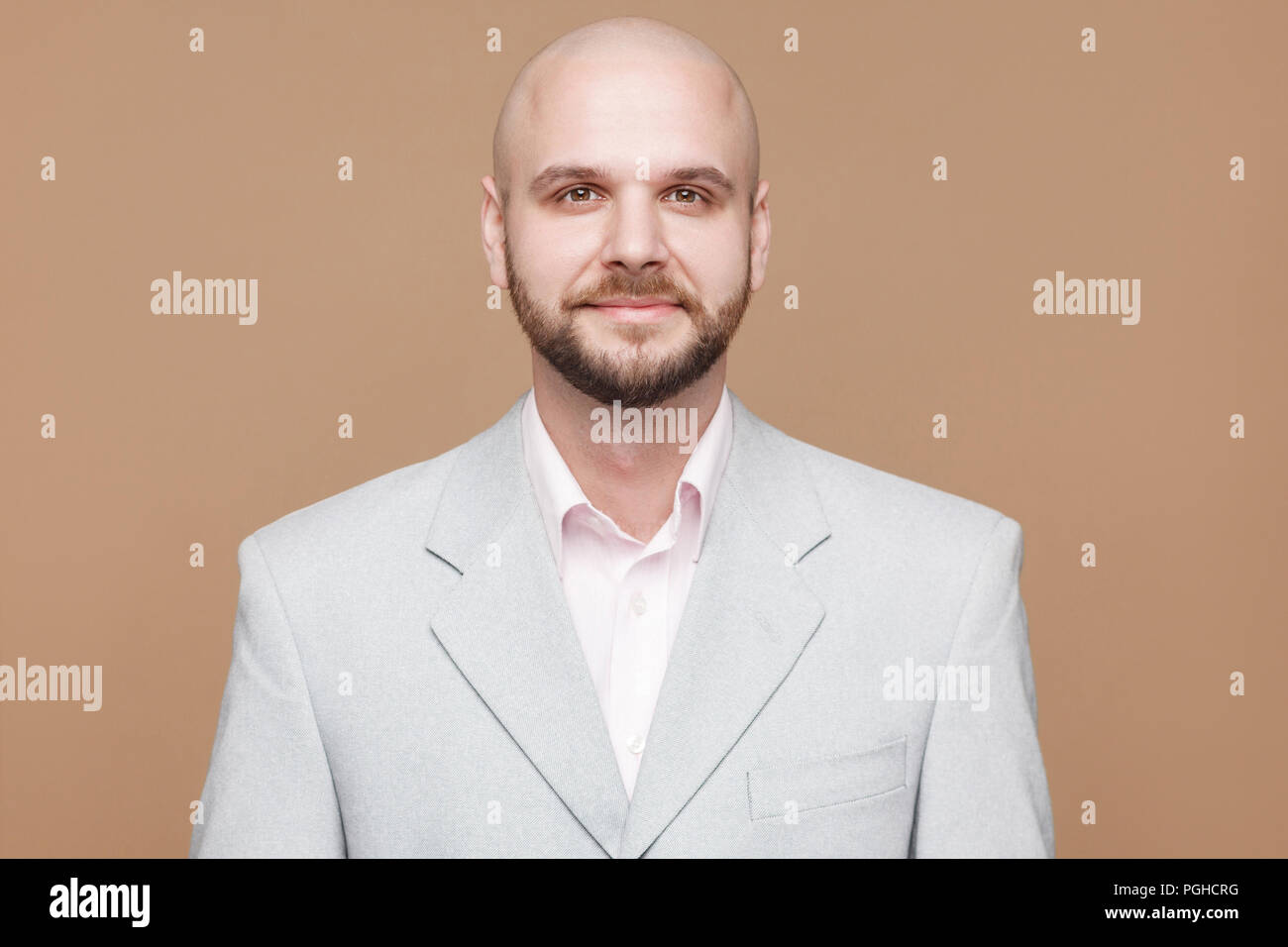 Portrait Of Happy Handsome Middle Aged Bald Bearded Businessman In