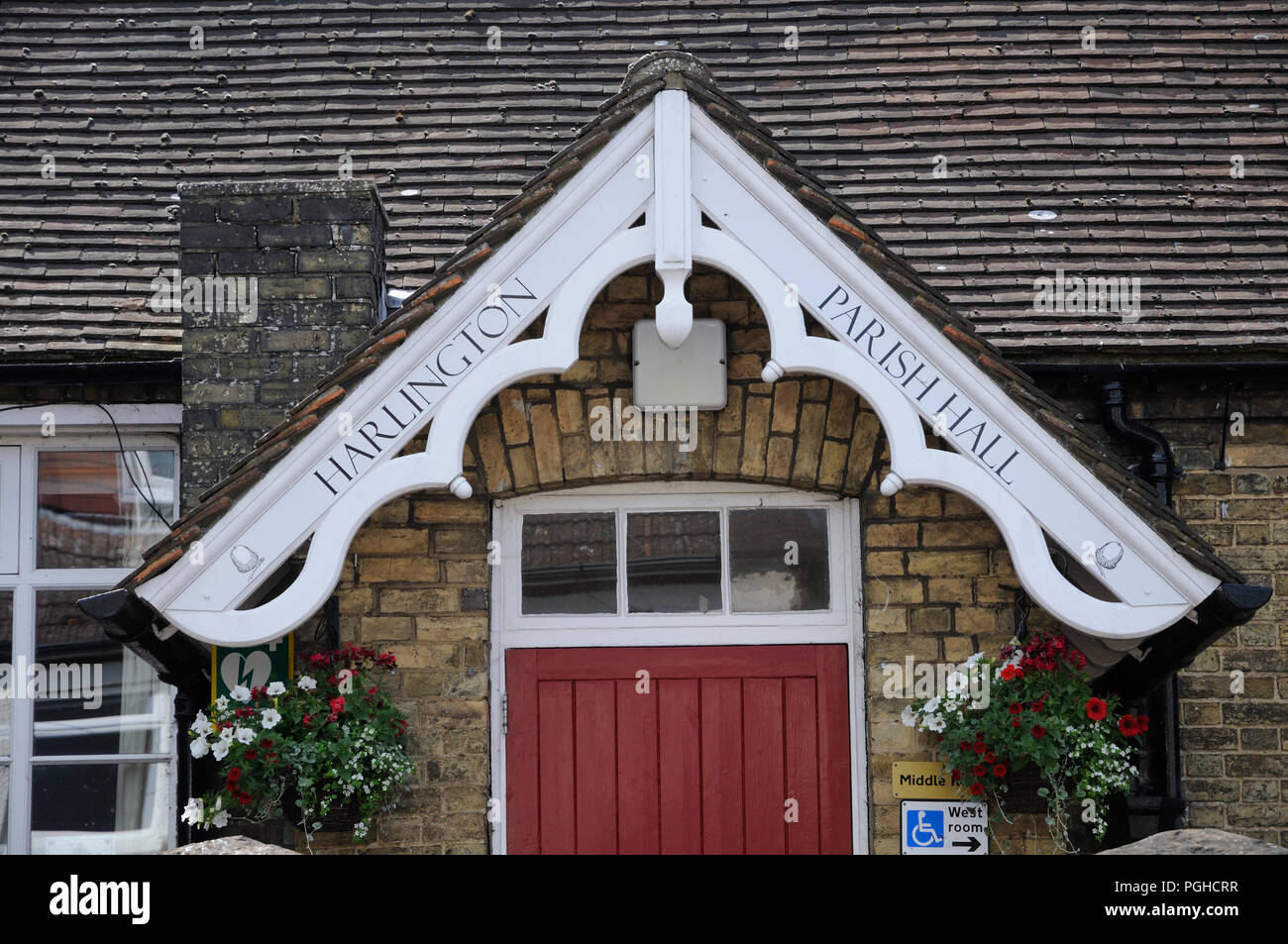 Harlington Parish Hall, Harlington, Bedfordshire, has a plaque bearing ...