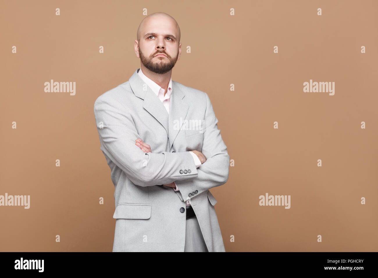 Portrait Of Confused Handsome Middle Aged Bald Bearded Businessman In