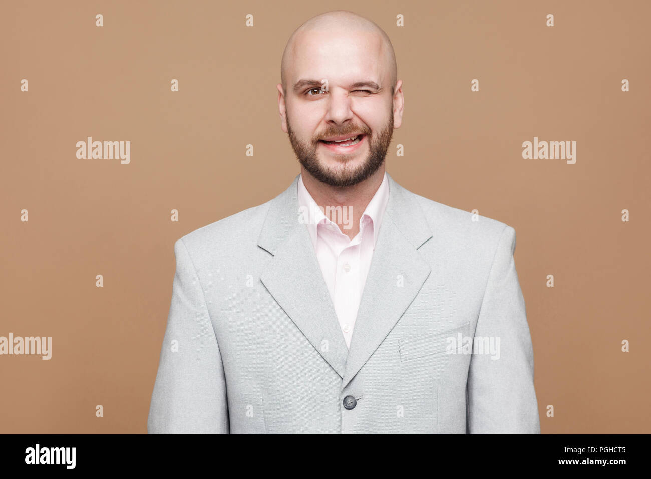 Portrait Of Happy Funny Handsome Middle Aged Bald Bearded Businessman