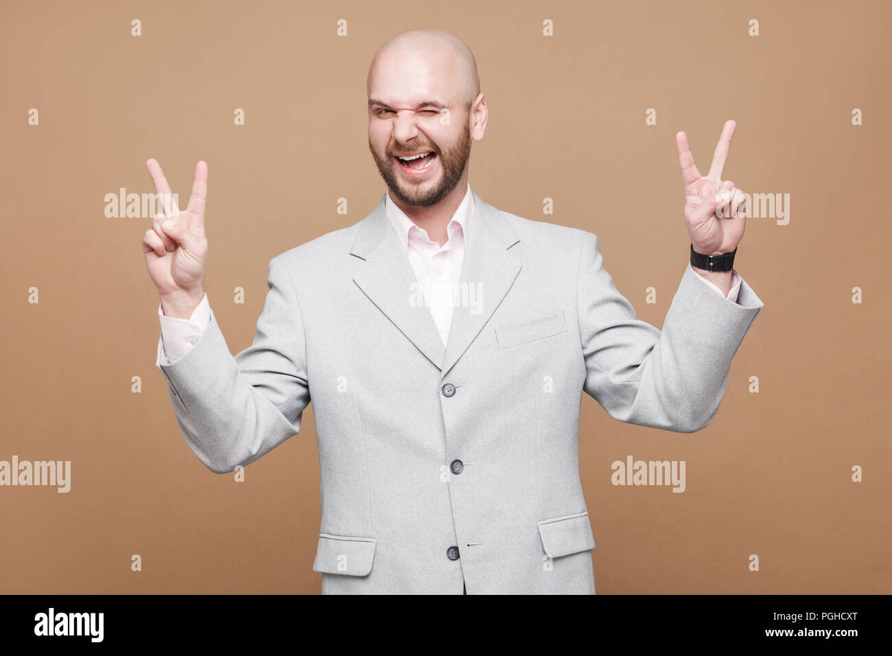 Funny Portrait Of Handsome Middle Aged Bald Bearded Businessman In