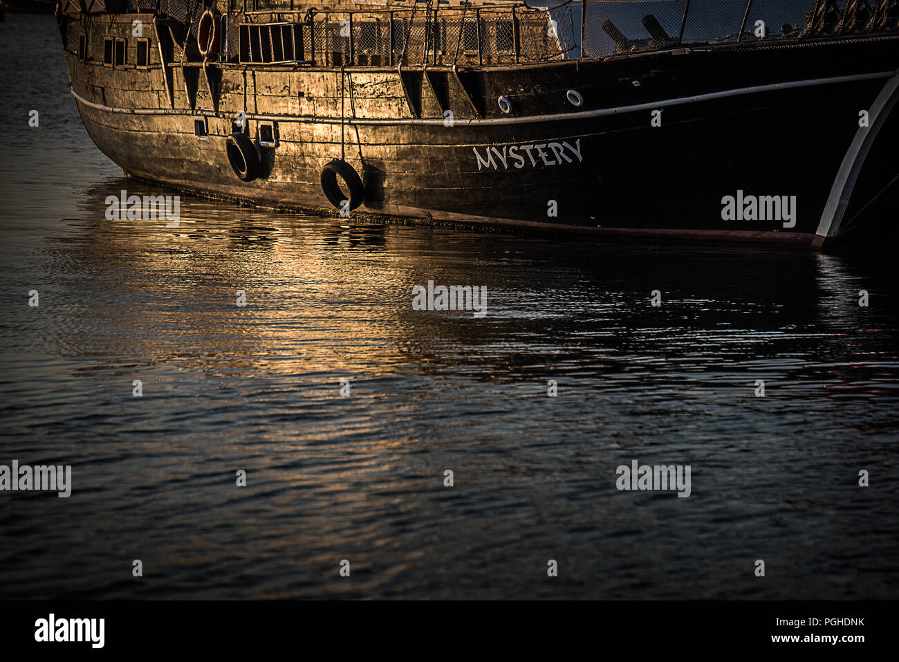 An old mystic ship with a golden glow Stock Photo - Alamy