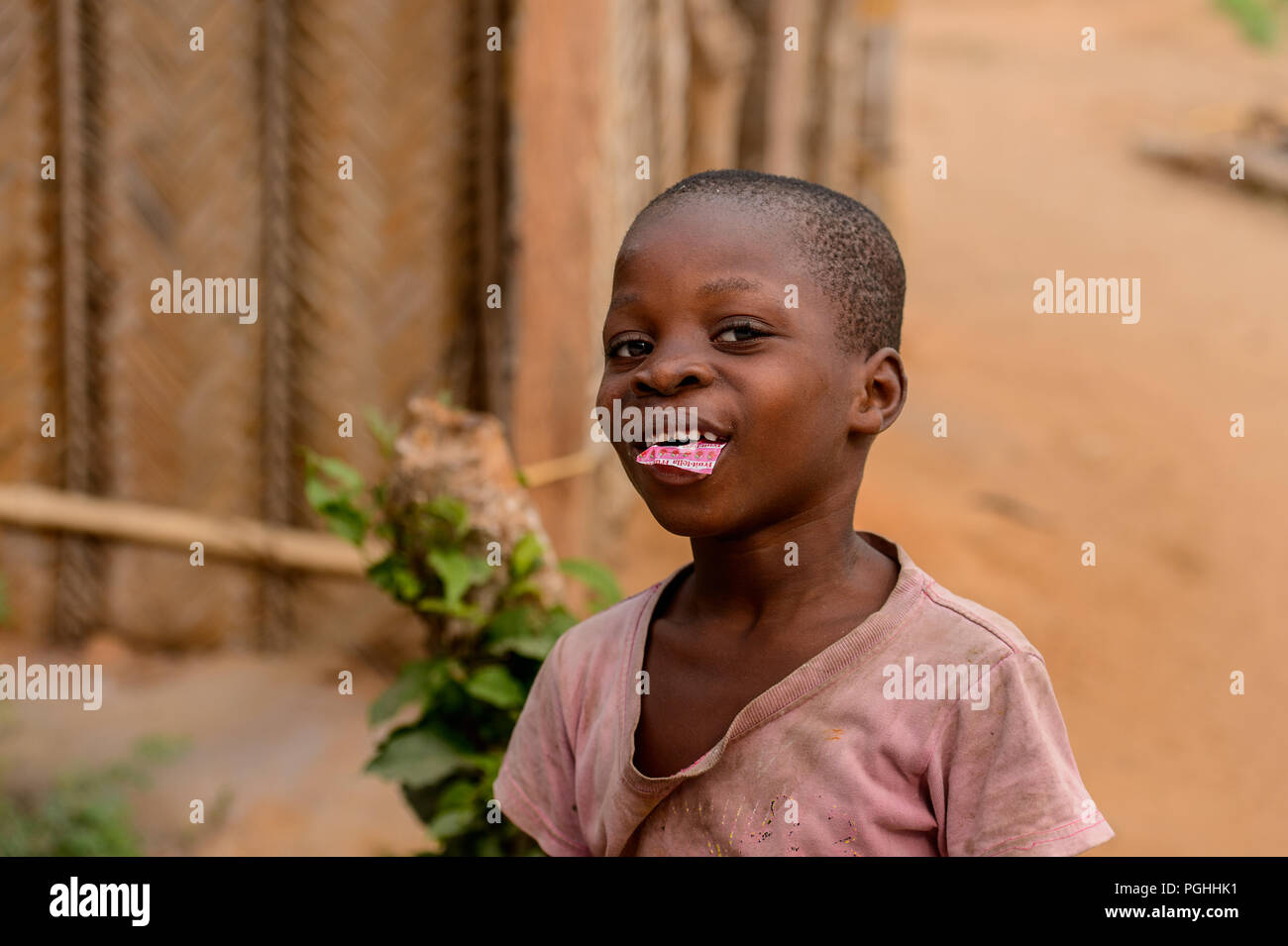 LOME, TOGO - Jan 9, 2017: Unidentified Togolese young boy puts ...