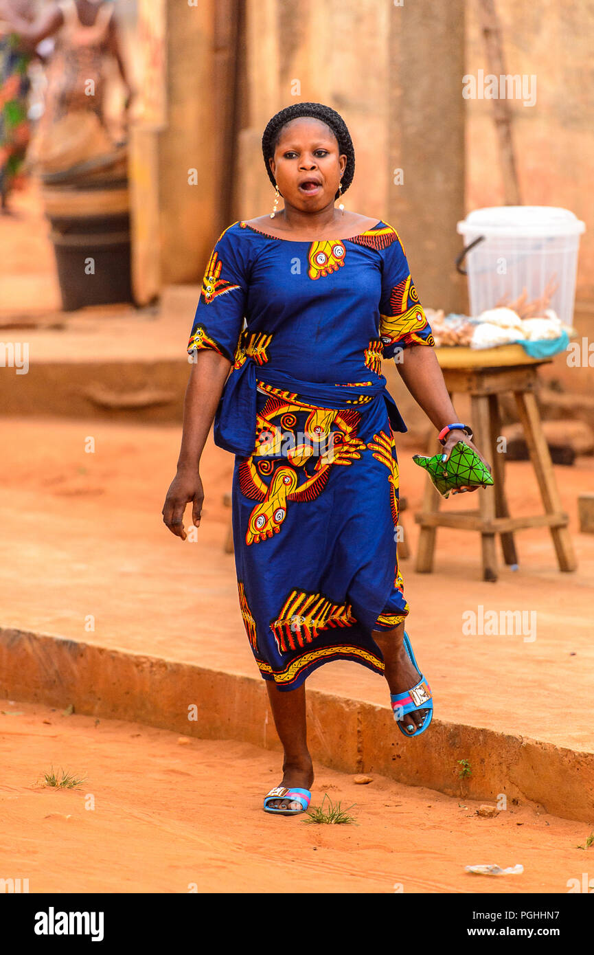 OUIDAH, BENIN - Jan 9, 2017: Unidentified Beninese woman in colored ...