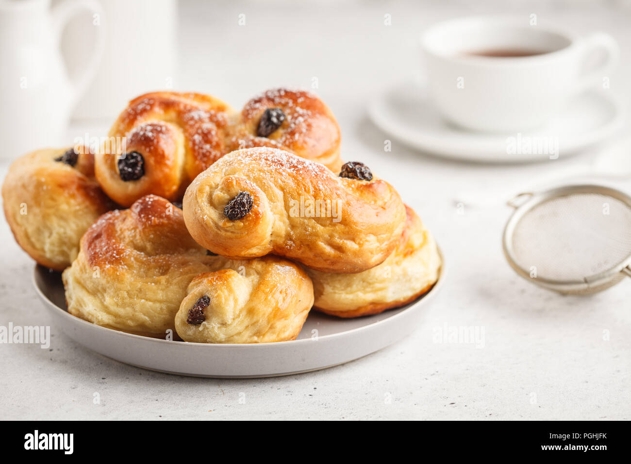 Traditional Swedish saffron buns (lussebulle or lussekatt), white ...