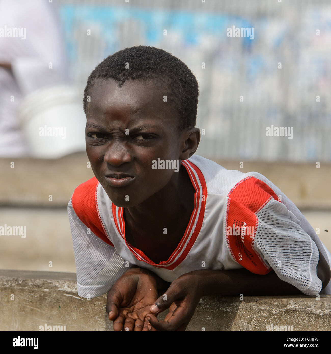 ACCRA, GHANA - Jan 8, 2017: Unidentified Ghanaian boy frowns at the ...