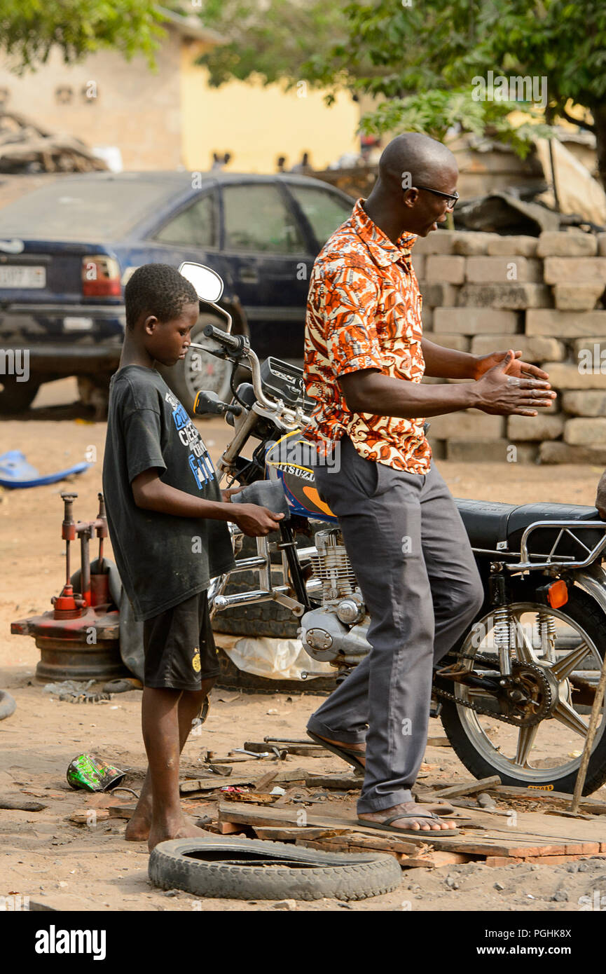 ACCRA, GHANA - Jan 8, 2017: Unidentified Ghanaian father and son stand ...