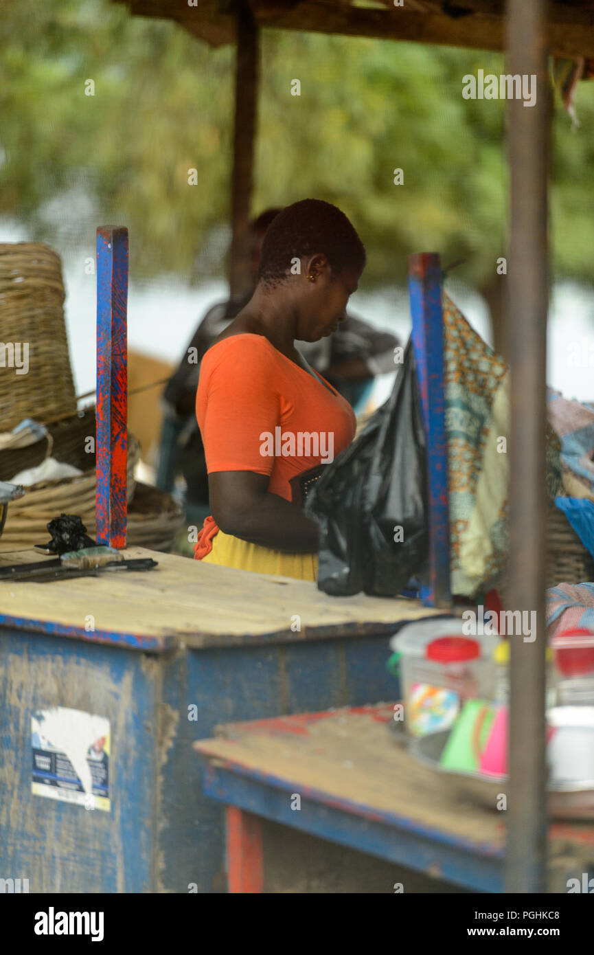 ACCRA, GHANA - Jan 8, 2017: Unidentified Ghanaian woman looks down on ...