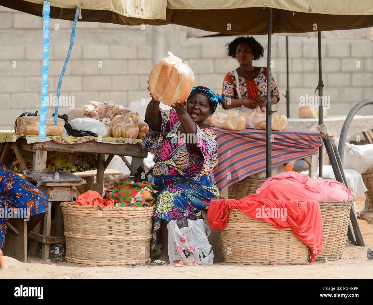 LOME, TOGO - Jan 9, 2017: Unidentified Togolese woman in colored dress ...