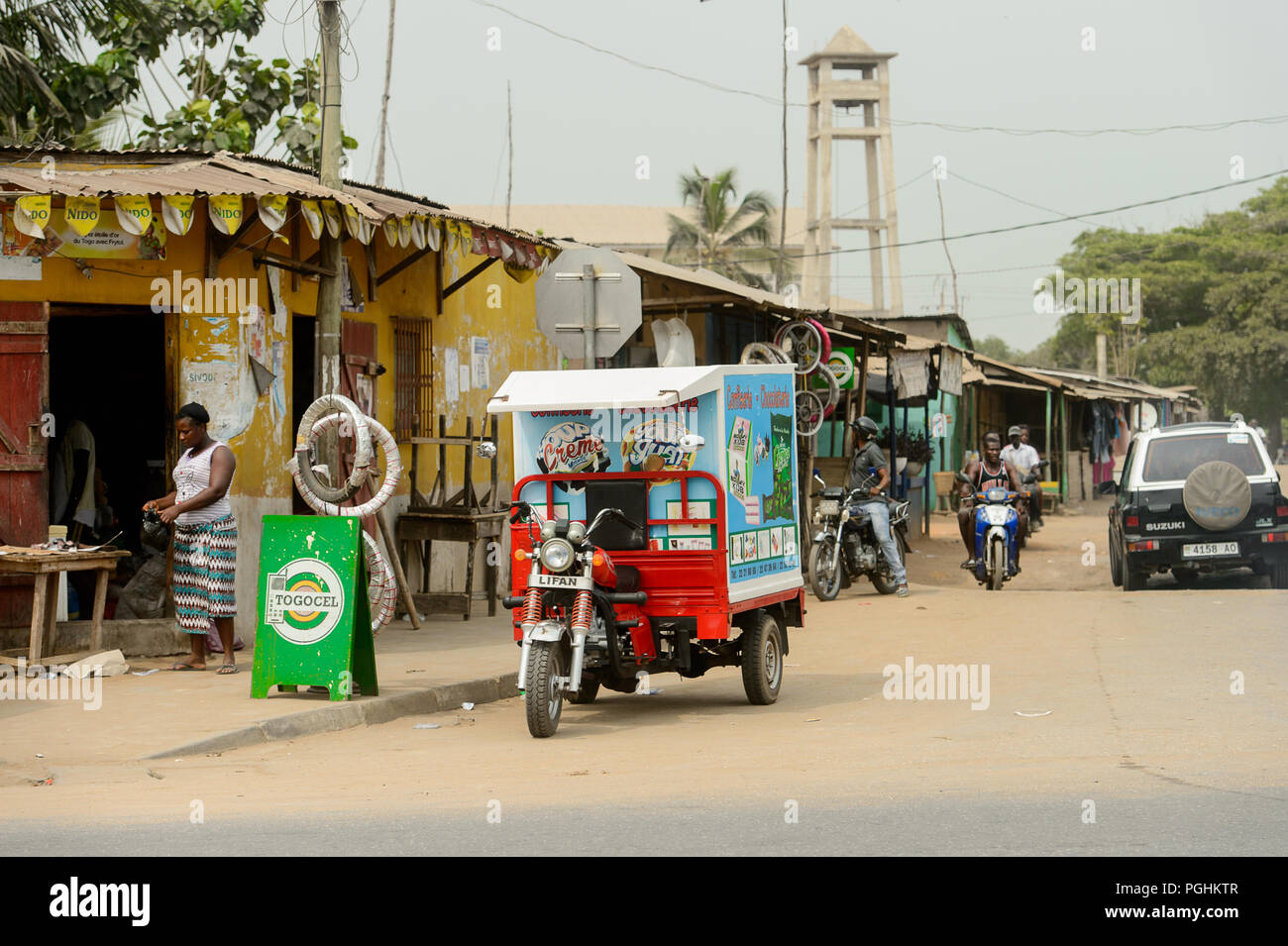 LOME, TOGO - Jan 9, 2017: Unidentified Togolese men ride motorcycles on ...