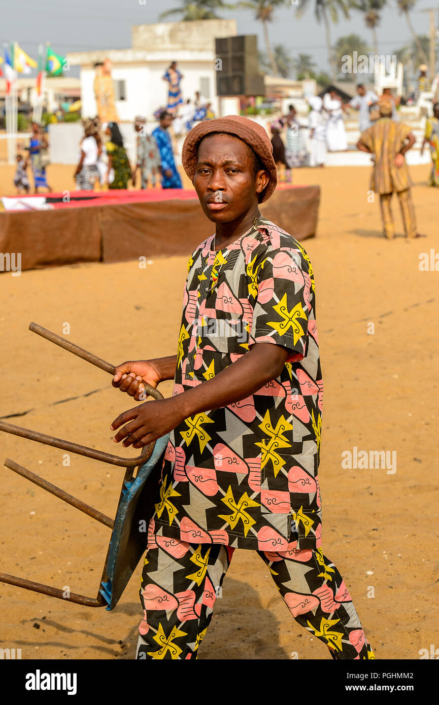 OUIDAH, BENIN - Jan 10, 2017: Unidentified Beninese man in colored suit ...