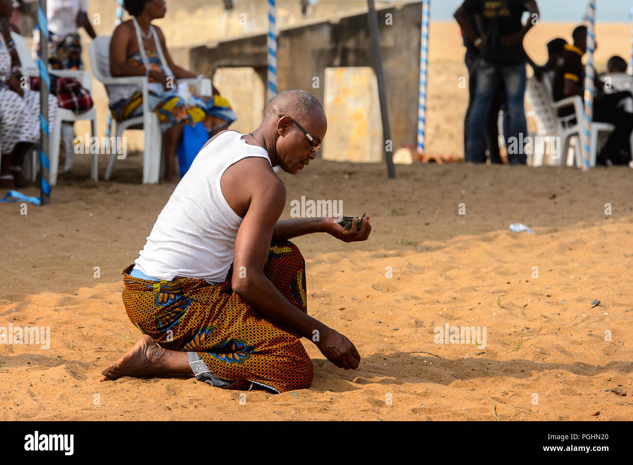 OUIDAH, BENIN - Jan 10, 2017: Unidentified Beninese man in colored ...