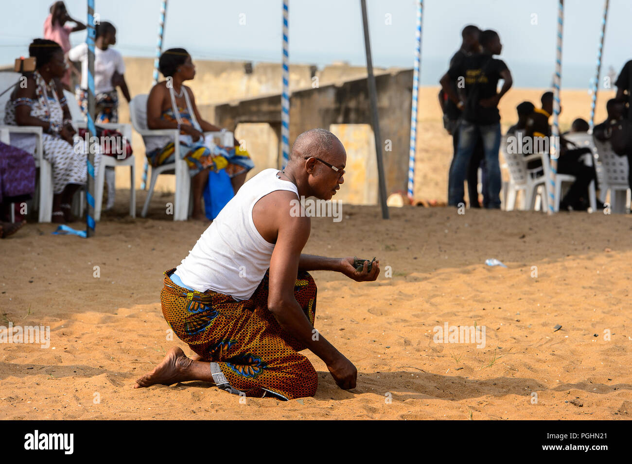 OUIDAH, BENIN - Jan 10, 2017: Unidentified Beninese man in colored ...