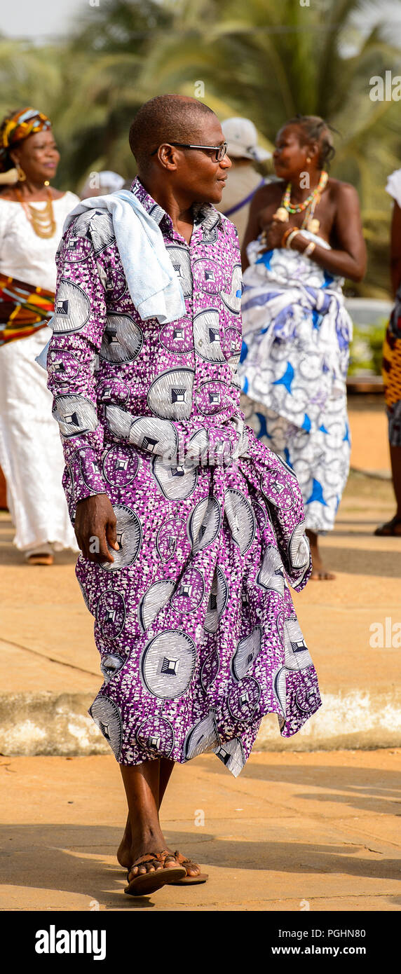 OUIDAH, BENIN - Jan 10, 2017: Unidentified Beninese man in colored ...
