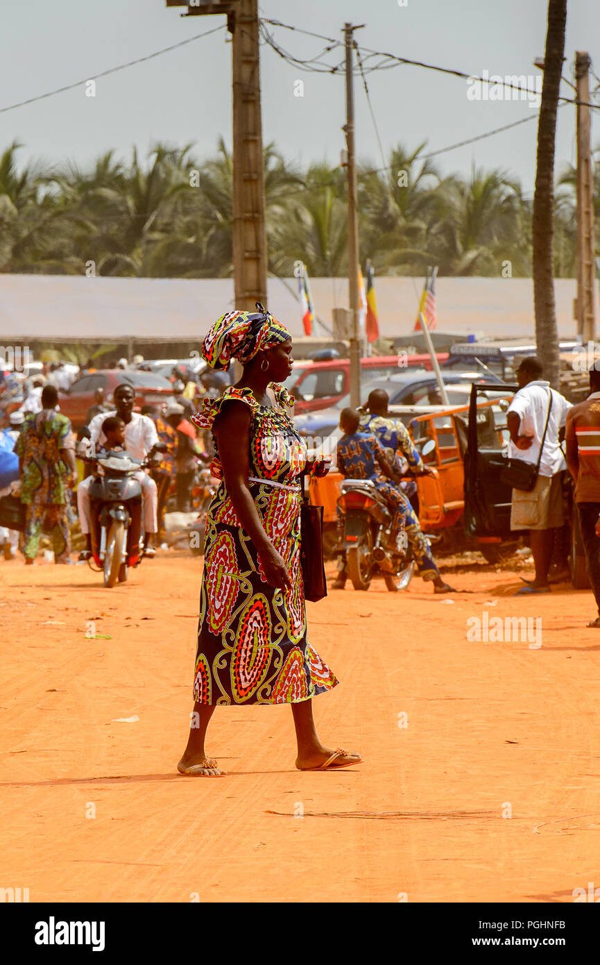 OUIDAH, BENIN - Jan 10, 2017: Unidentified Beninese woman in colored ...