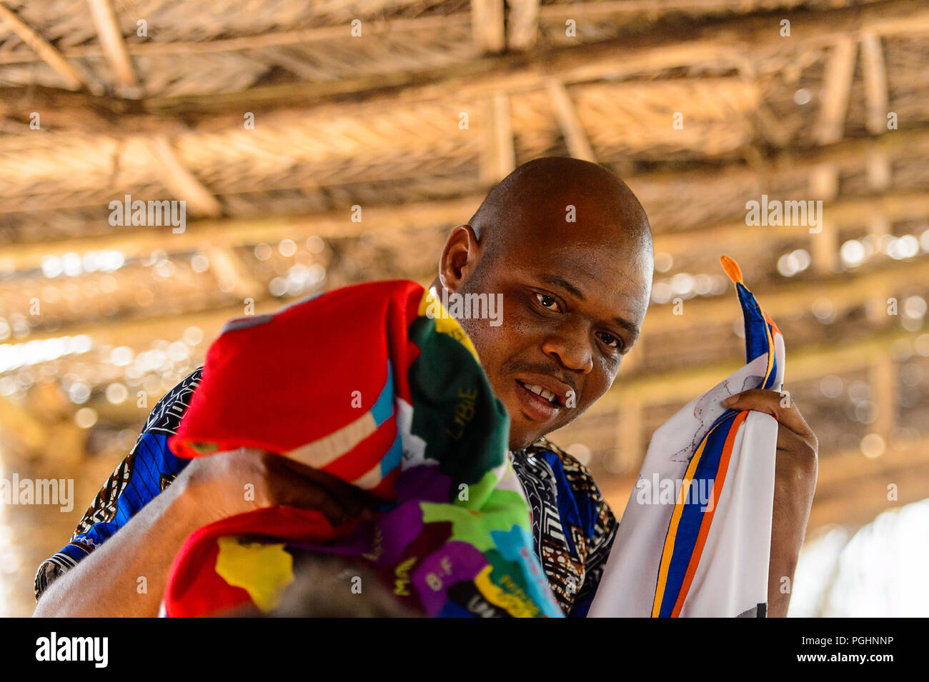 OUIDAH, BENIN - Jan 10, 2017: Unidentified Beninese man in colored ...