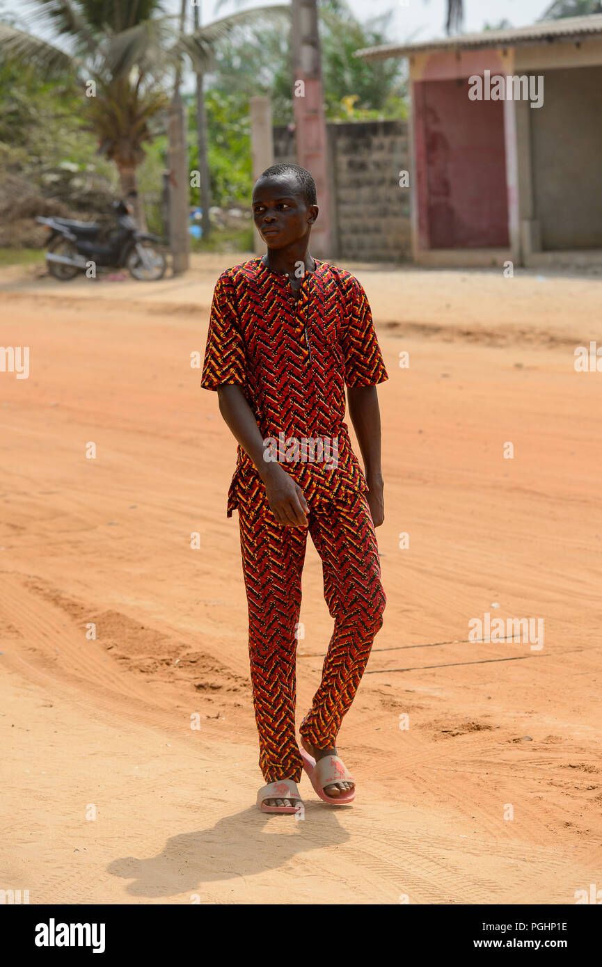 OUIDAH, BENIN - Jan 10, 2017: Unidentified Beninese man in colored suit ...