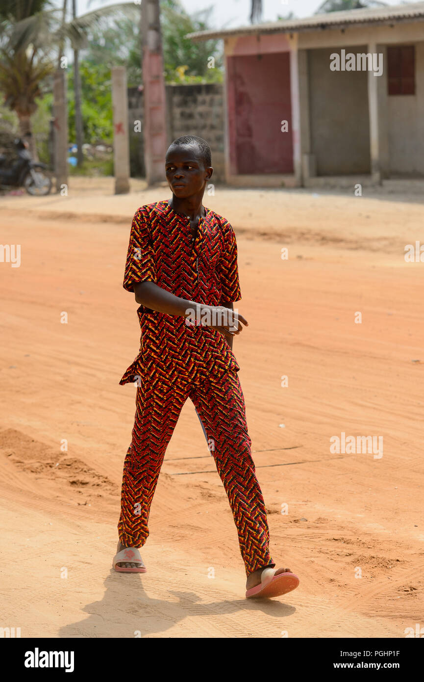 OUIDAH, BENIN - Jan 10, 2017: Unidentified Beninese man in colored suit ...