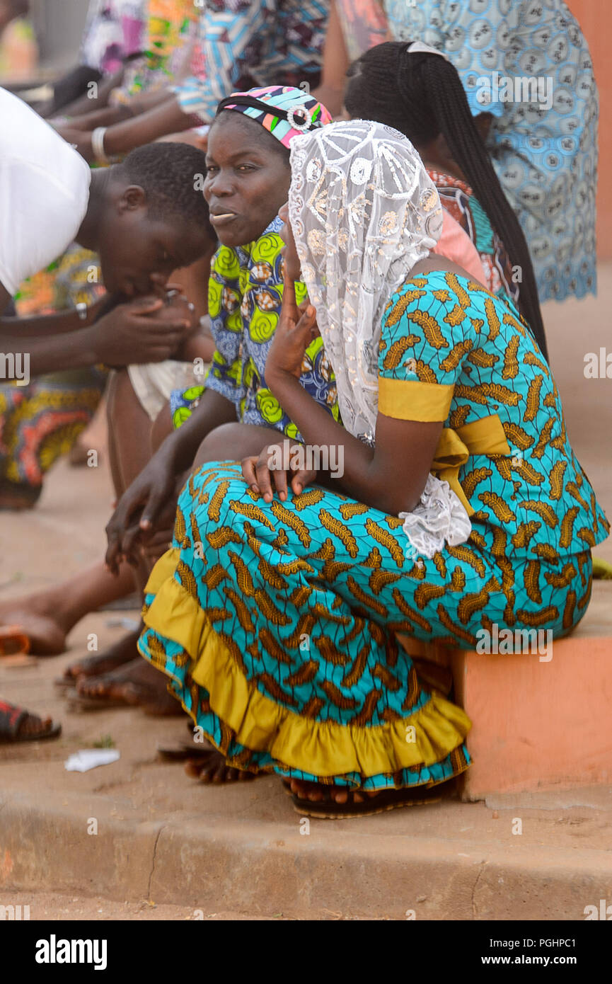 OUIDAH, BENIN - Jan 10, 2017: Unidentified Beninese women in colored ...