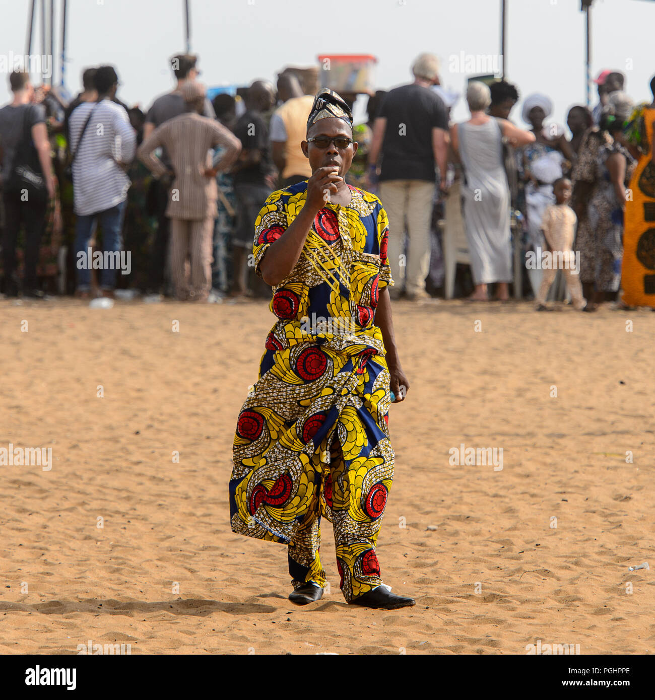 OUIDAH, BENIN - Jan 10, 2017: Unidentified Beninese man in colored ...