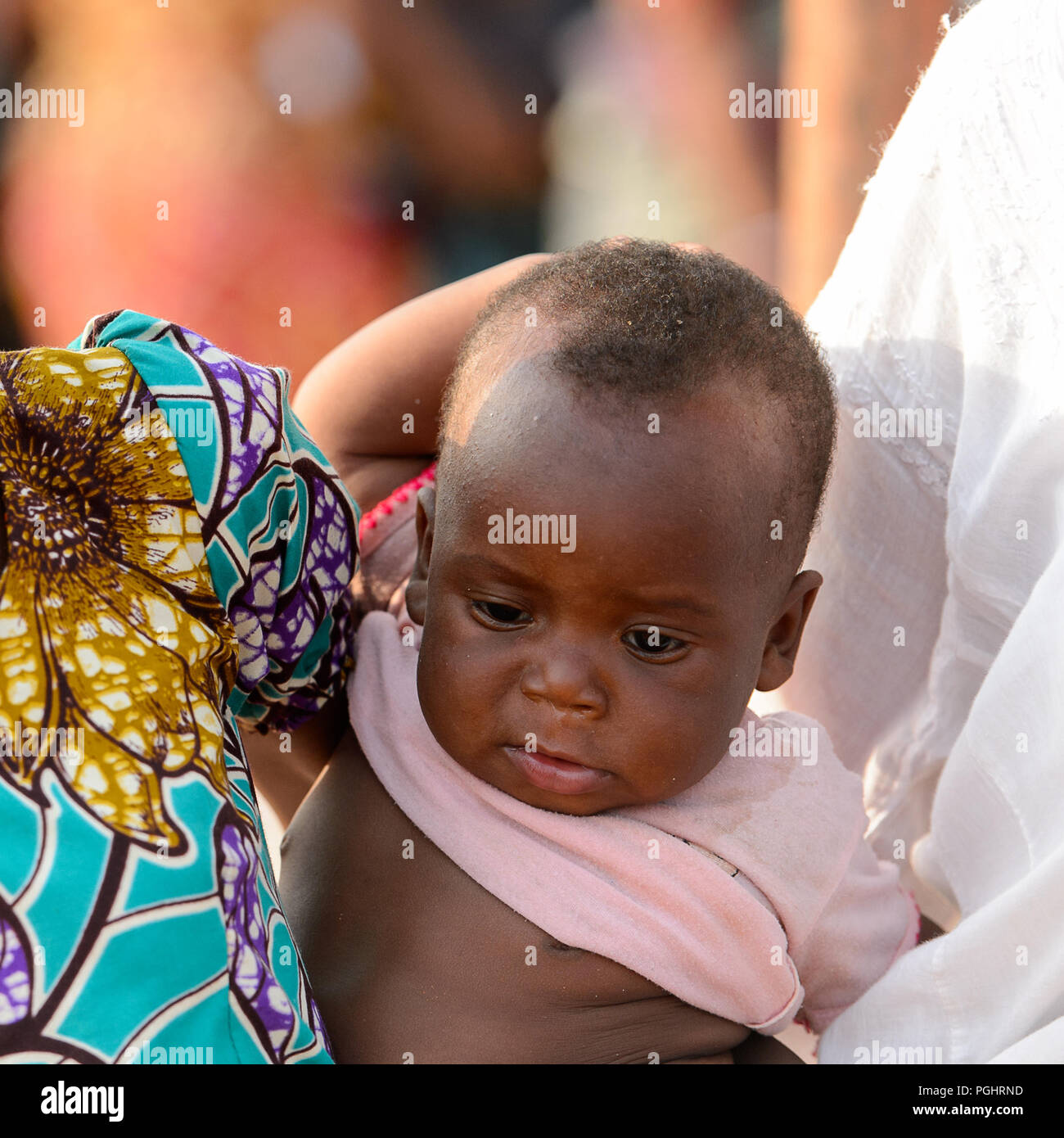 OUIDAH, BENIN - Jan 10, 2017: Unidentified Beninese little baby in pink ...
