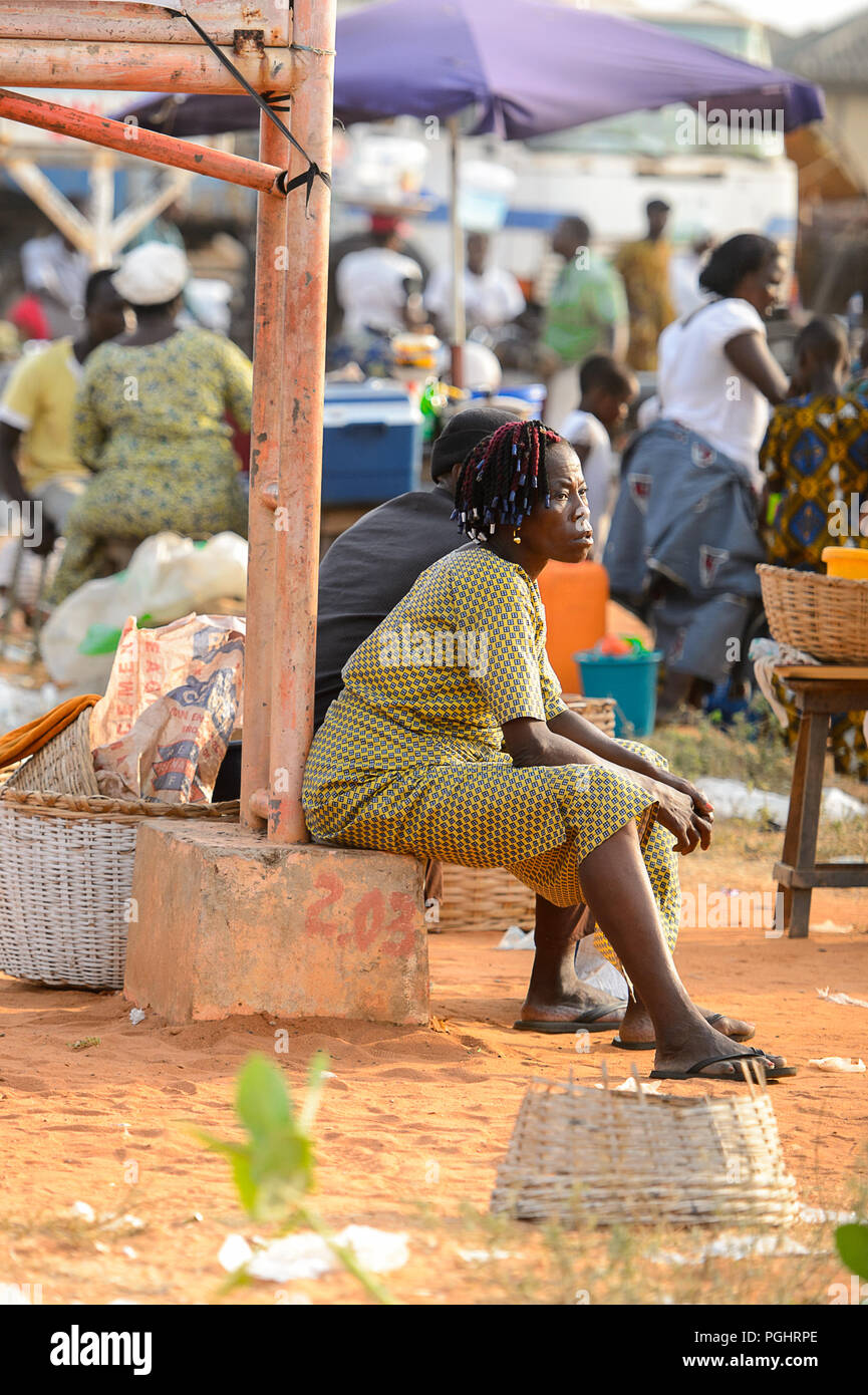 OUIDAH, BENIN - Jan 10, 2017: Unidentified Beninese woman with braids ...