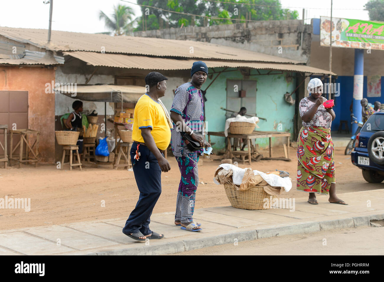 OUIDAH, BENIN - Jan 10, 2017: Unidentified Beninese two men stand ...