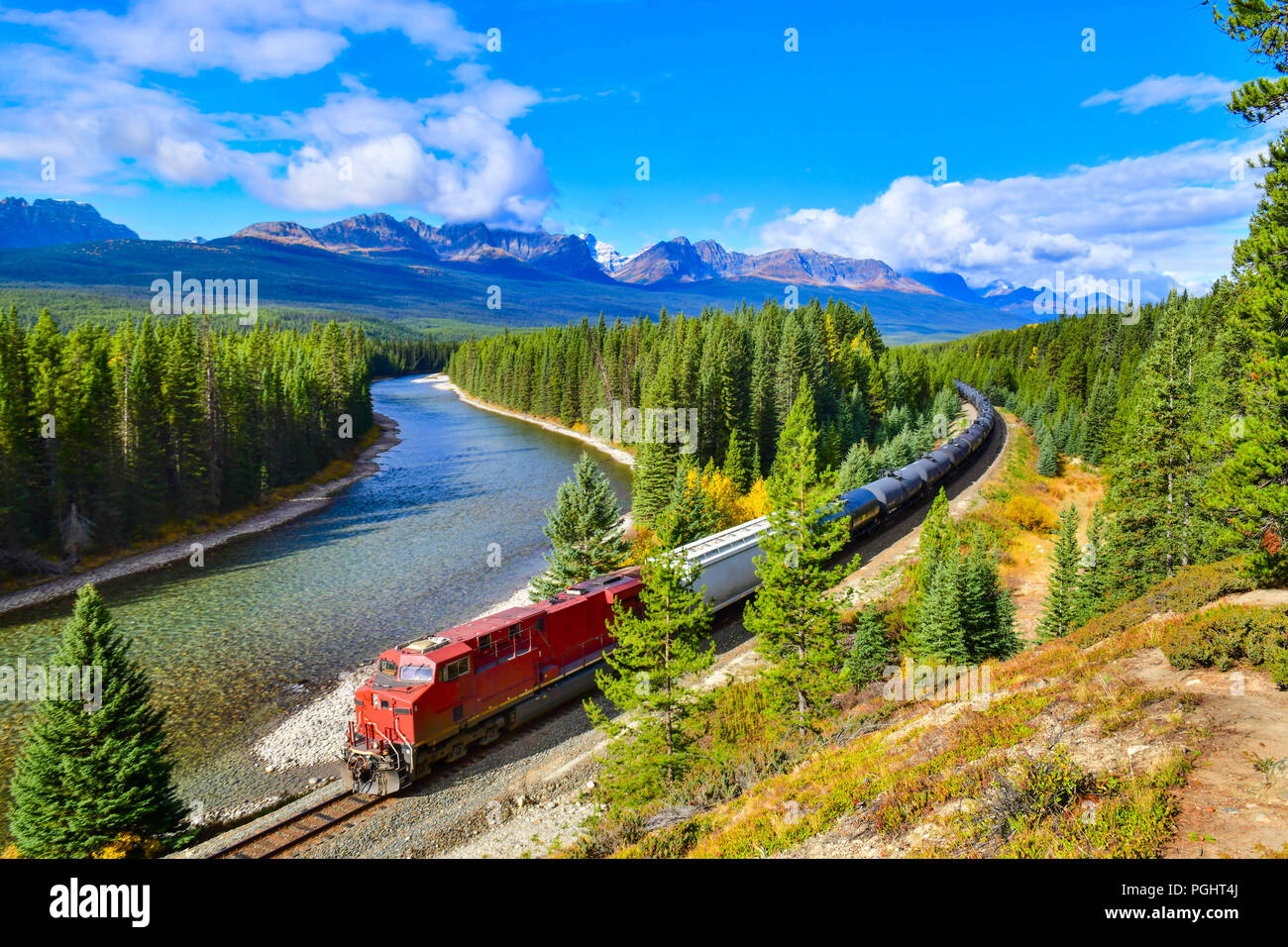 Train passing famous Morant's curve at Bow Valley in autumn ,Banff National Park, Canadian ...