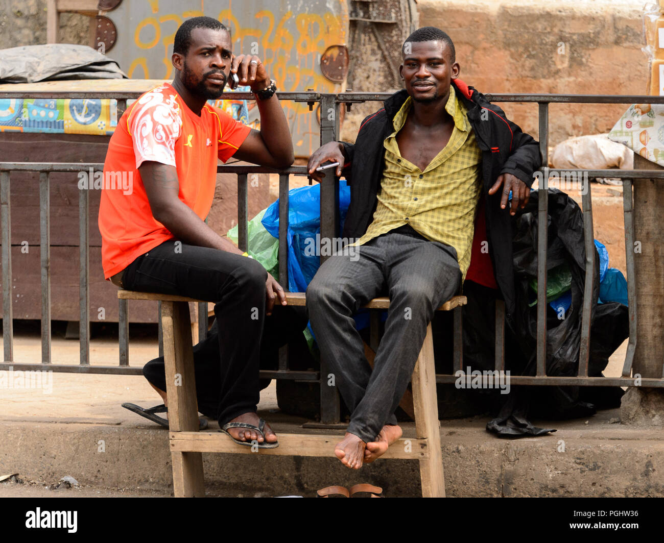 KUMASI, GHANA - Jan 16, 2017: Unidentified Ghanaian two men sit on the ...