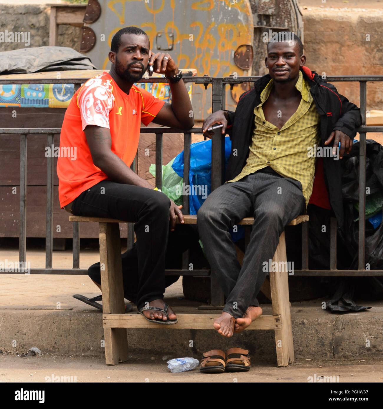 KUMASI, GHANA - Jan 16, 2017: Unidentified Ghanaian two men sit on the ...