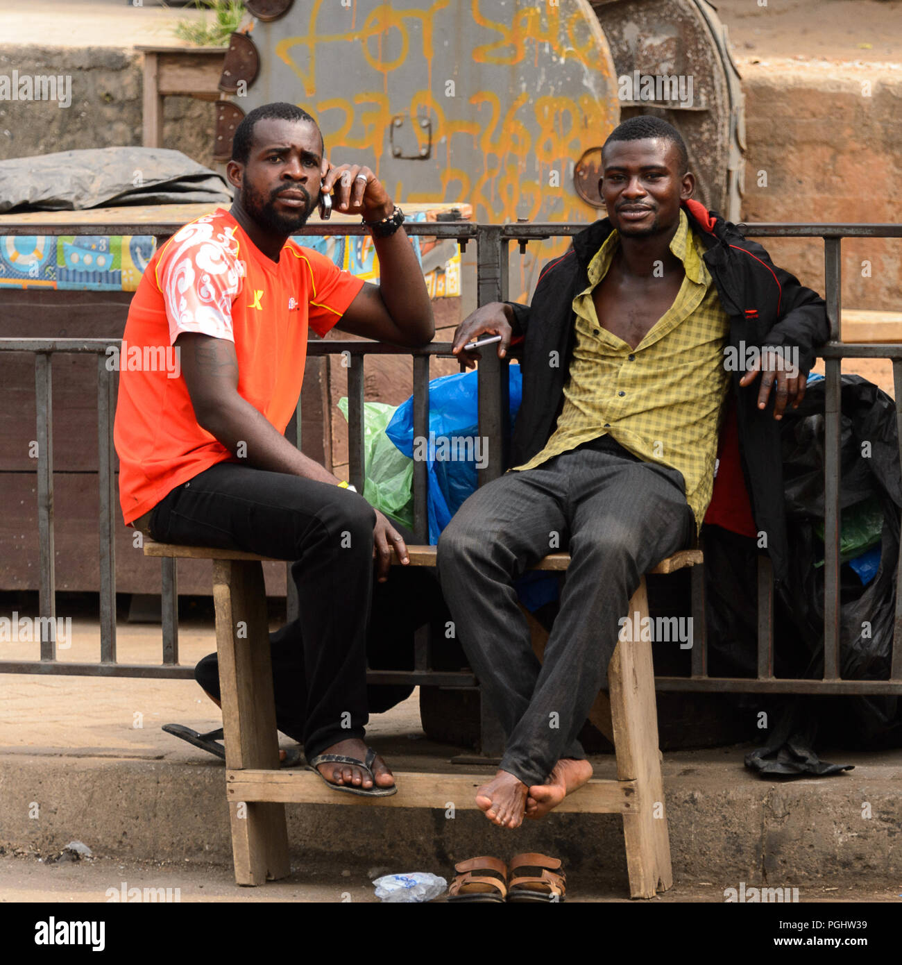 KUMASI, GHANA - Jan 16, 2017: Unidentified Ghanaian two men sit on the ...
