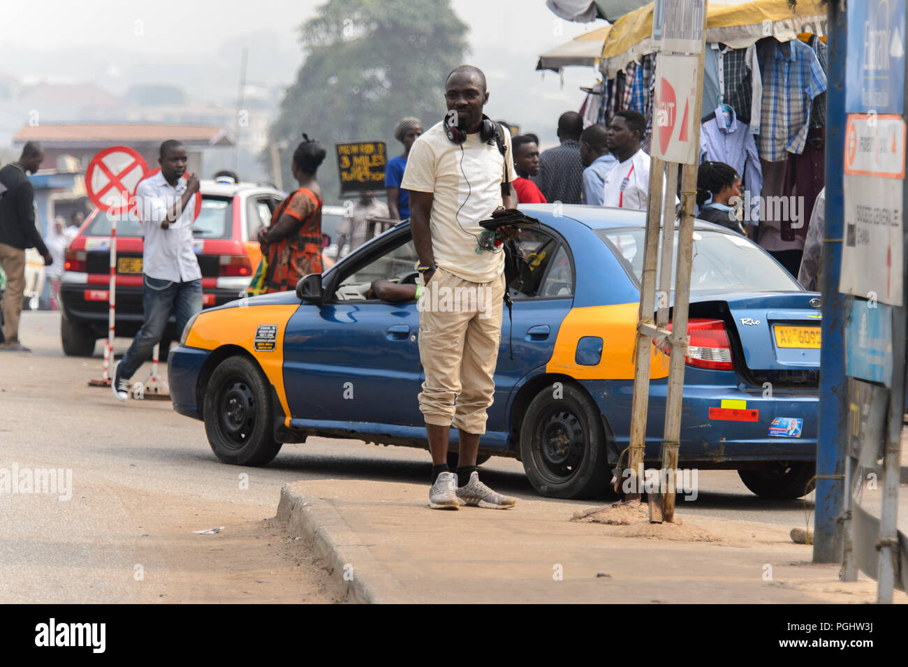 KUMASI, GHANA - Jan 16, 2017: Unidentified Ghanaian man in beige suit ...