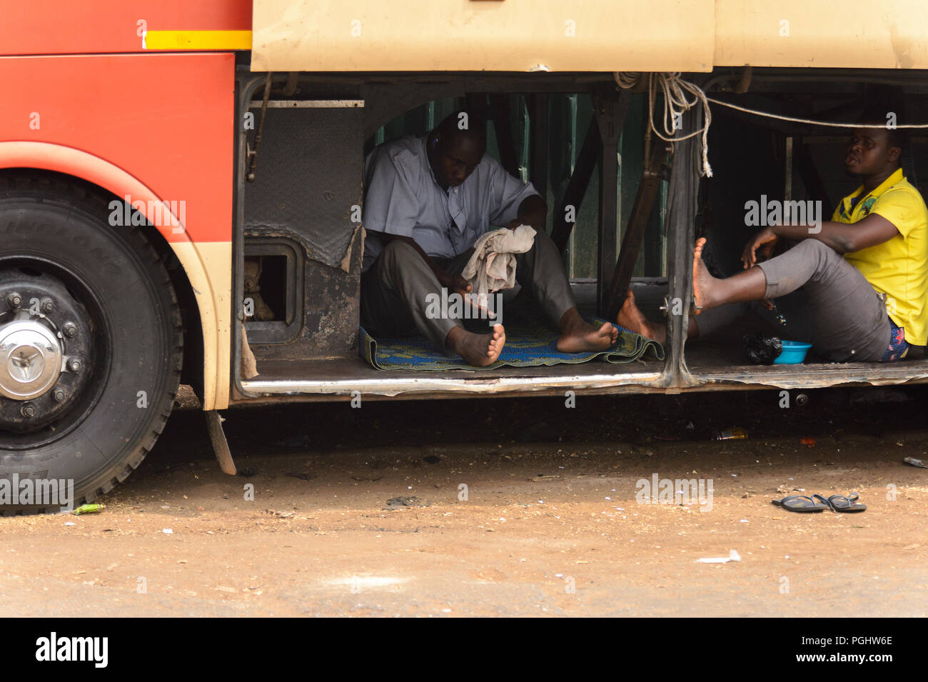 KUMASI, GHANA - Jan 16, 2017: Unidentified Ghanaian people sit in the ...