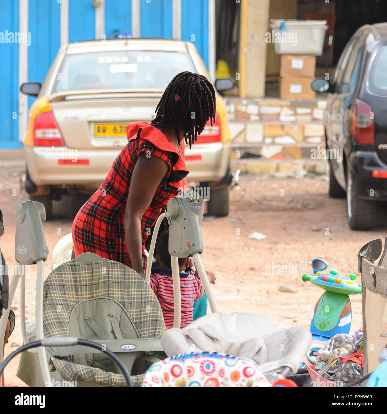 KUMASI, GHANA - Jan 16, 2017: Unidentified Ghanaian woman in plaid ...
