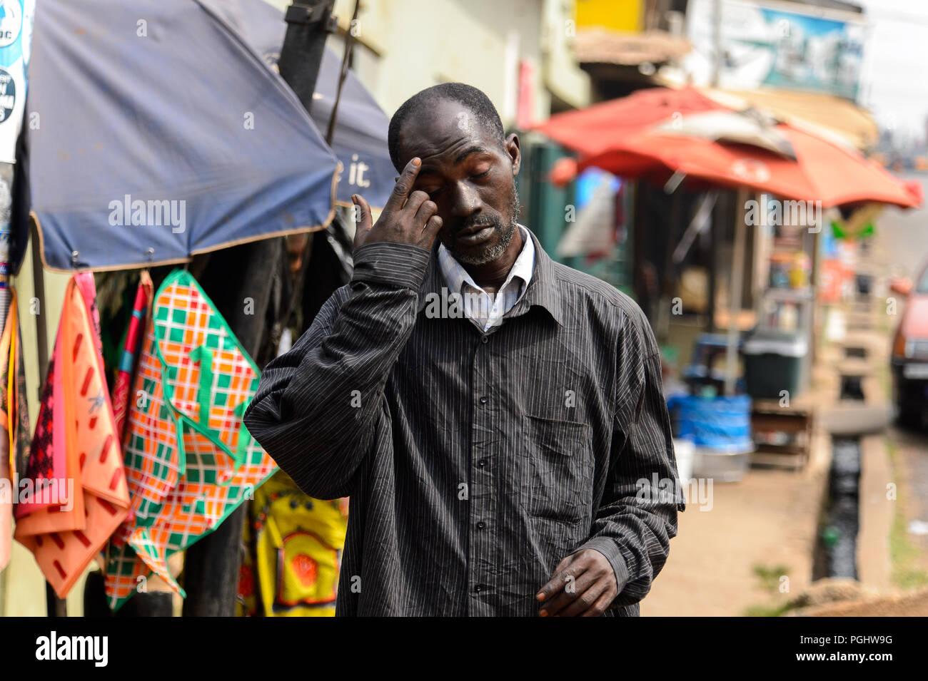 KUMASI, GHANA - Jan 16, 2017: Unidentified Ghanaian man in dark clothes ...