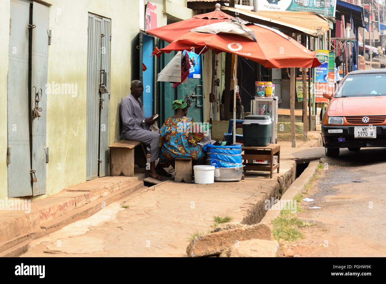 KUMASI, GHANA - Jan 16, 2017: Unidentified Ghanaian people sell food ...