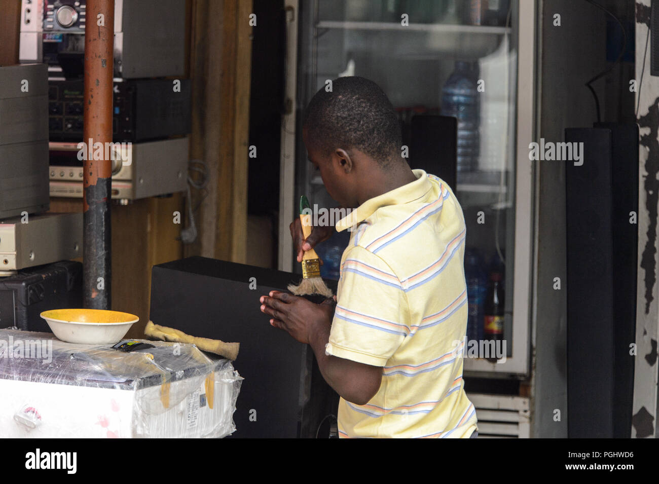 KUMASI, GHANA - Jan 16, 2017: Unidentified Ghanaian boy in yellow shirt ...