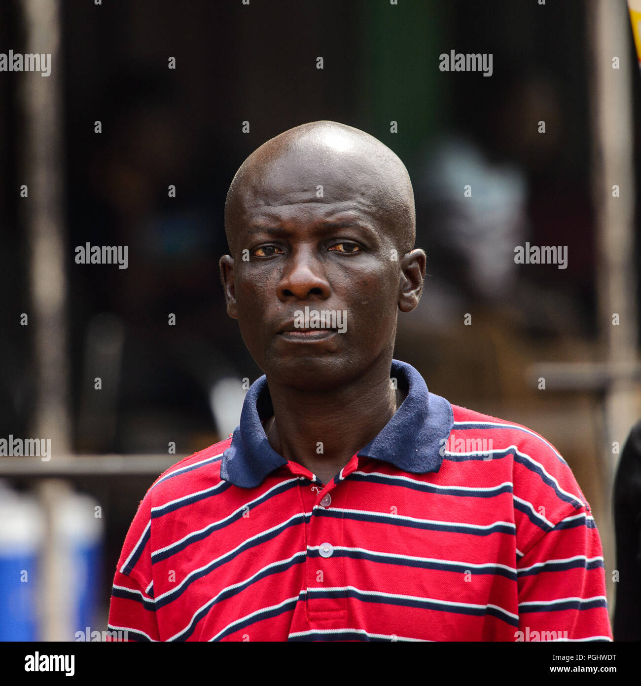KUMASI, GHANA - Jan 16, 2017: Unidentified Ghanaian .man in red shirt ...
