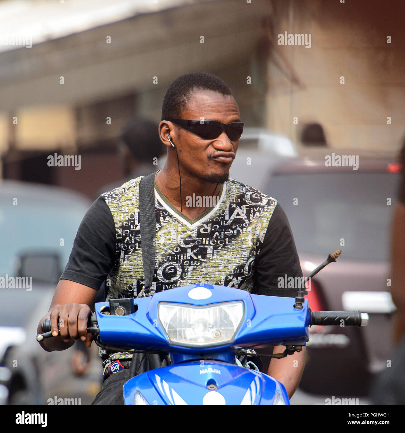 KUMASI, GHANA - Jan 16, 2017: Unidentified Ghanaian man in sunglasses ...