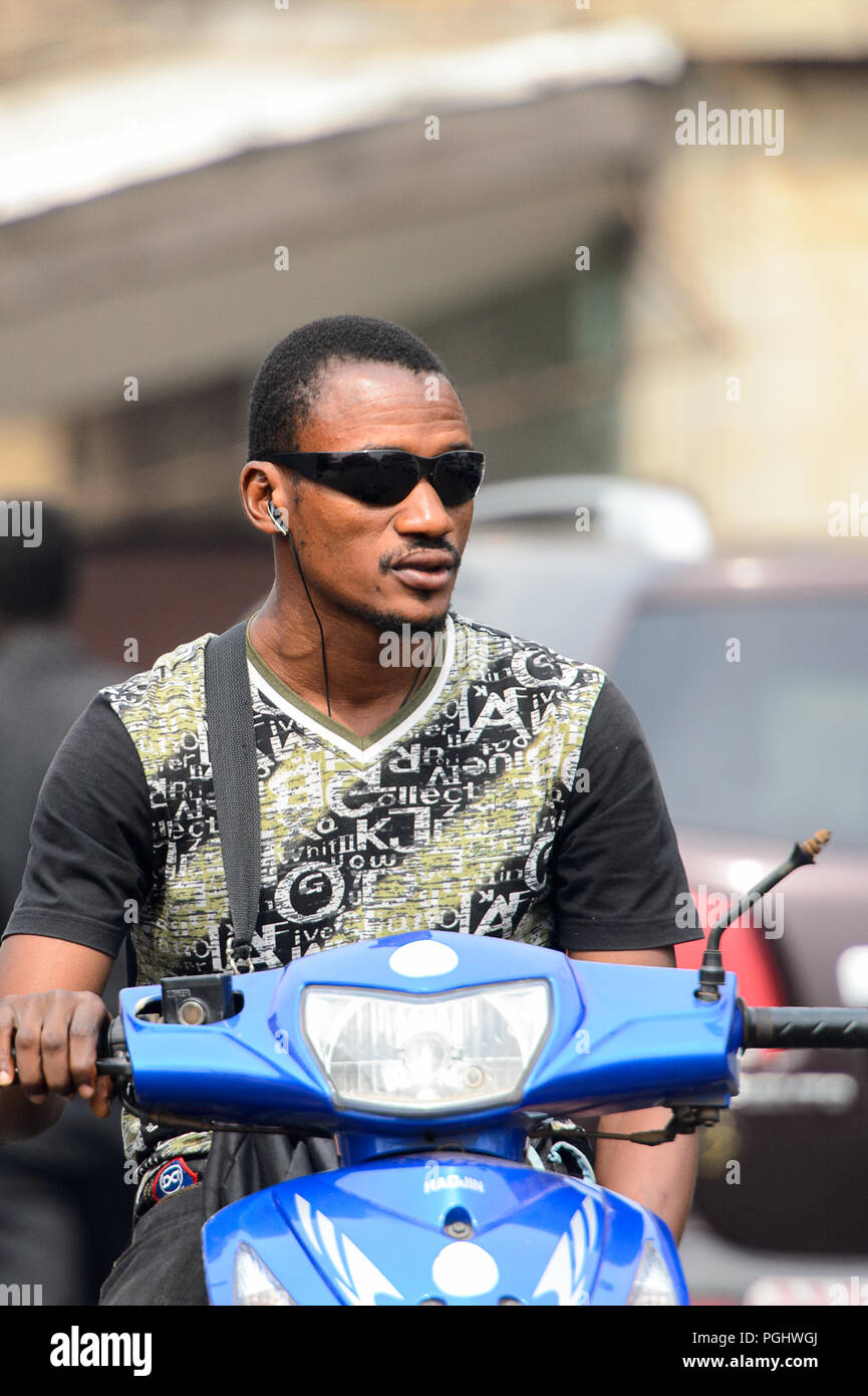 KUMASI, GHANA - Jan 16, 2017: Unidentified Ghanaian man in sunglasses ...