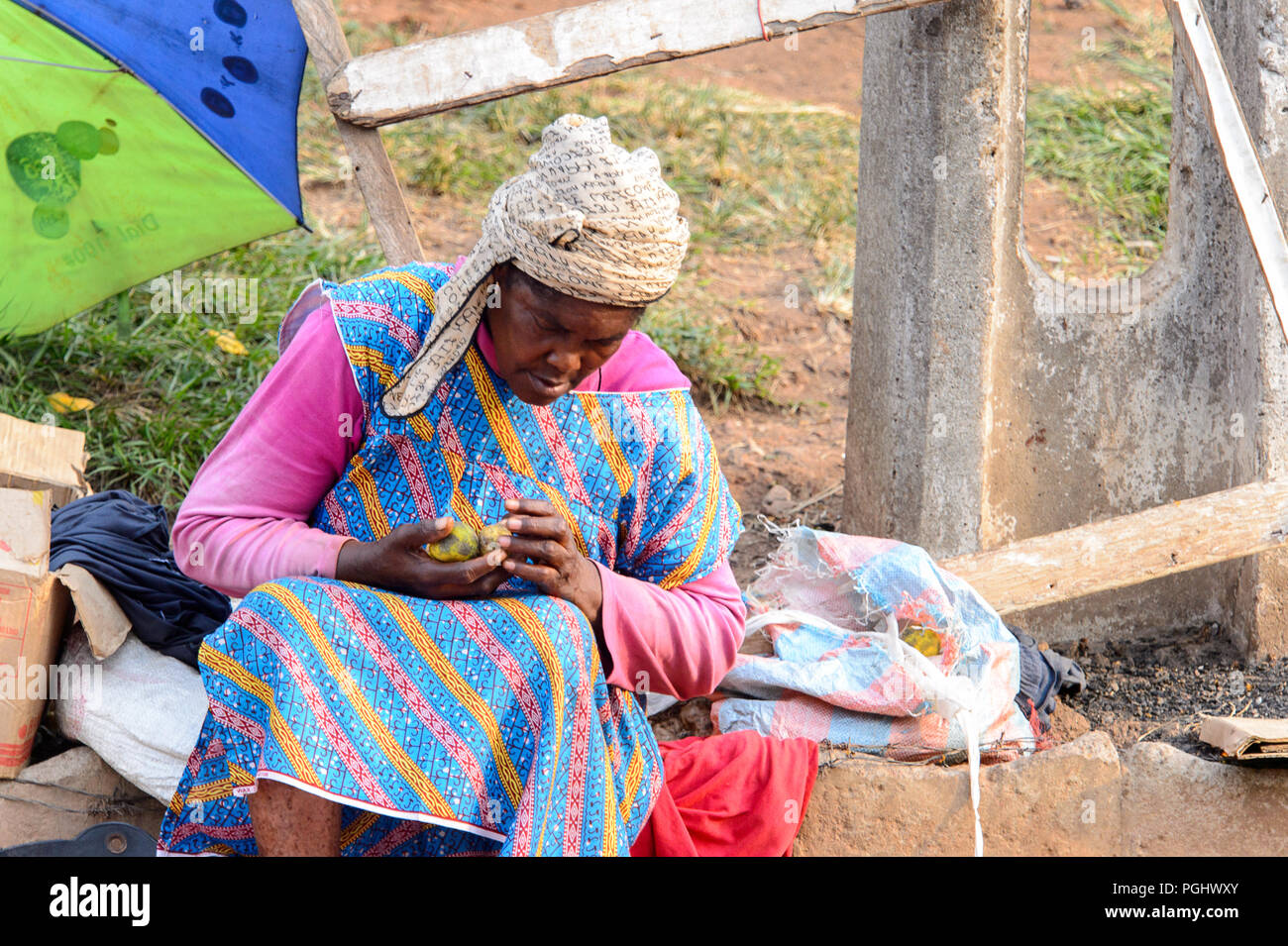 KUMASI, GHANA - Jan 16, 2017: Unidentified Ghanaian woman sits on the ...