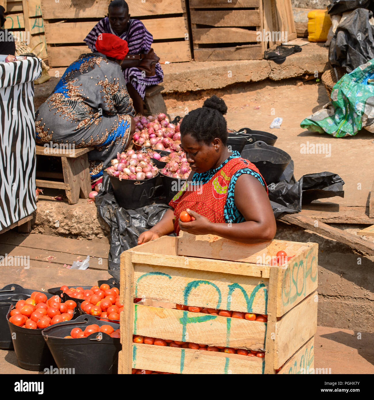 CENTRAL REGION, GHANA - Jan 17, 2017: Unidentified Ghanaian woman sorts ...