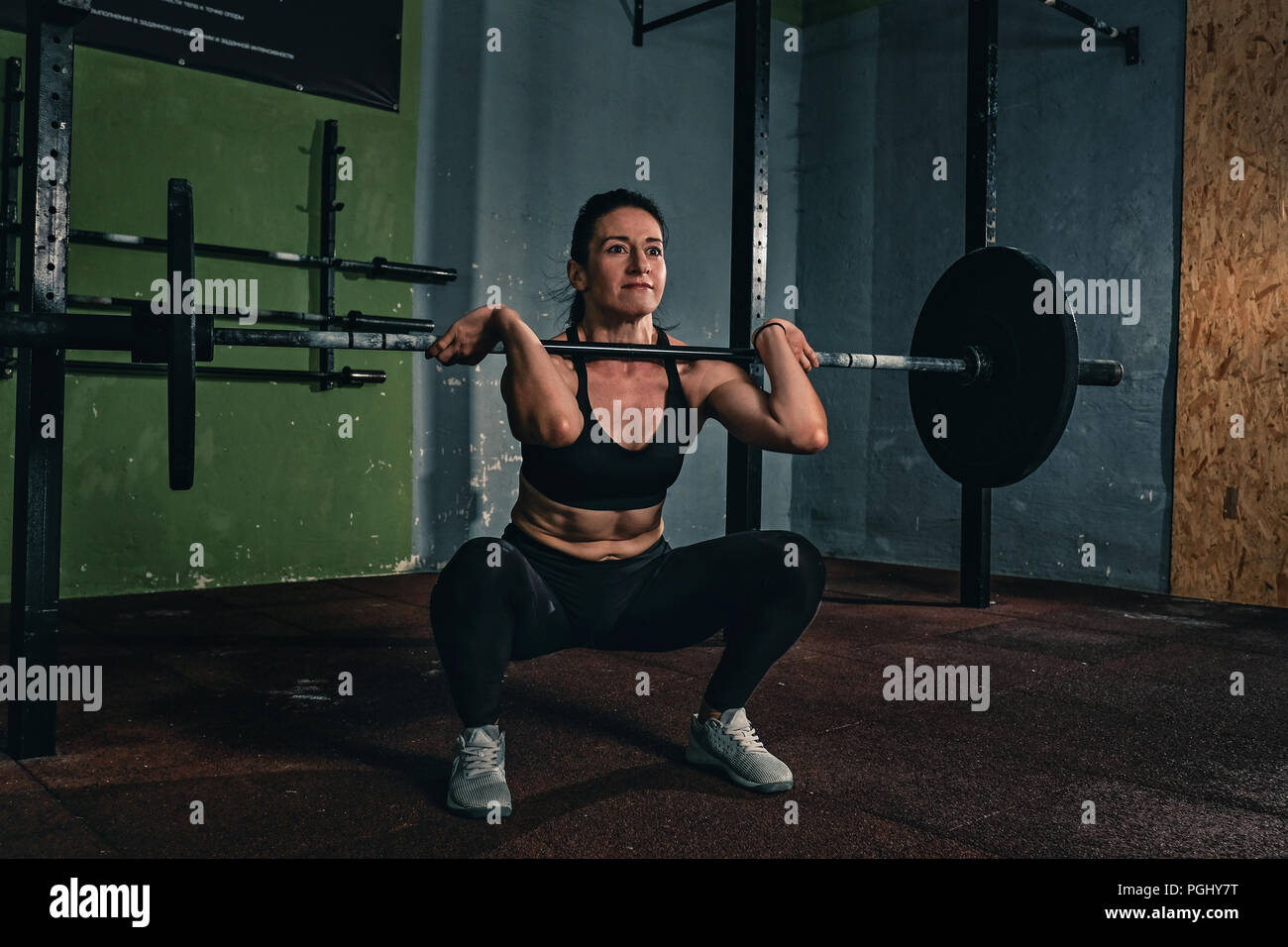 Girl doing squats hi-res stock photography and images - Alamy