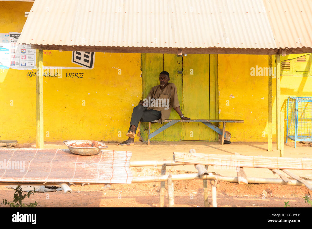 CENTRAL REGION, GHANA - Jan 17, 2017: Unidentified Ghanaian man sits on ...